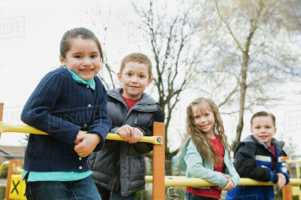 Elementary school students playing in playground at recess - Stock ...