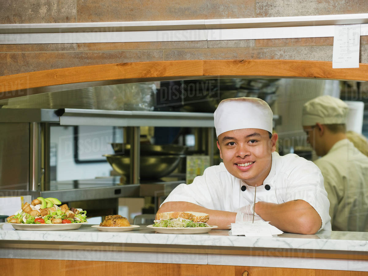 Chef leaning on counter - Stock Photo - Dissolve