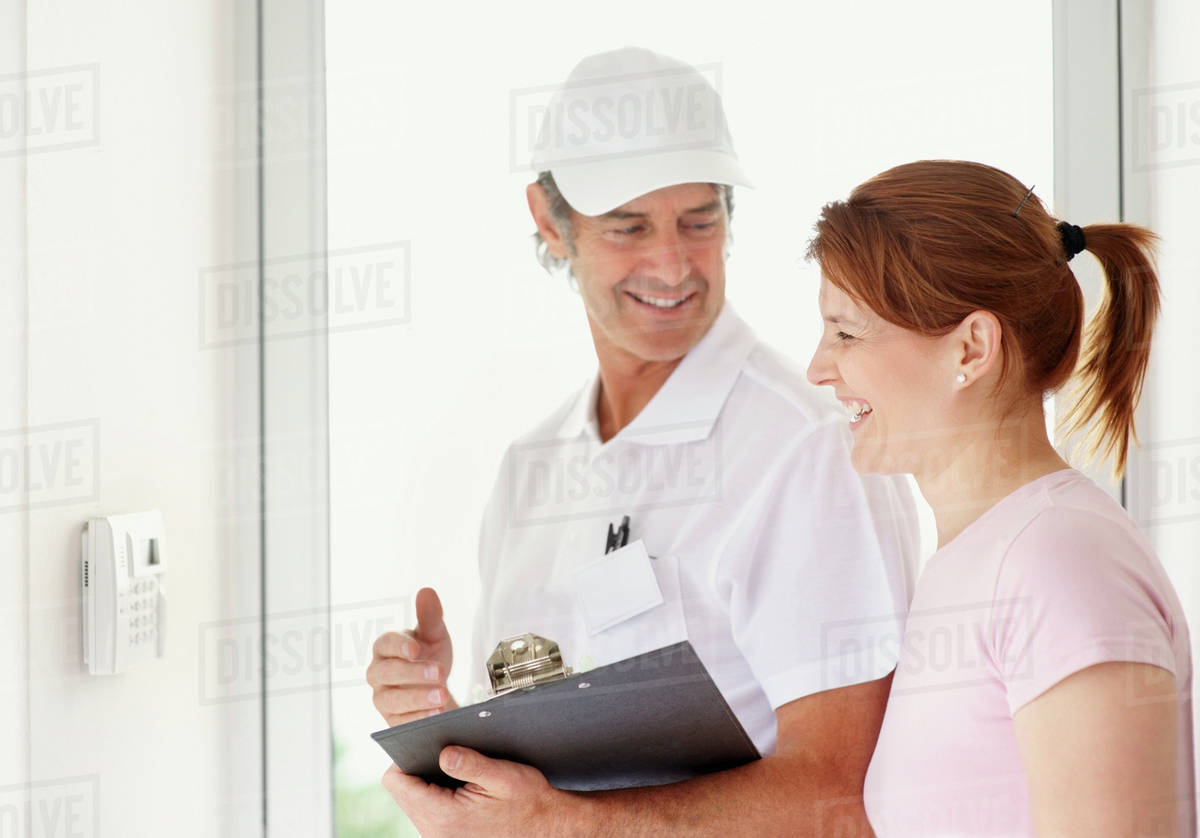 Repair person and customer - Royalty-free Stock Photo | Dissolve