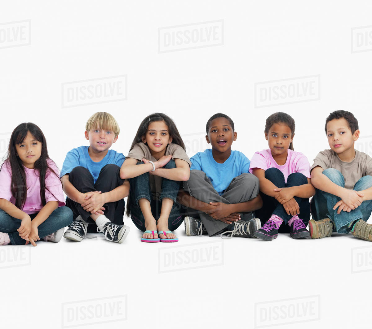 Children sitting in a row - Royalty-free Stock Photo | Dissolve