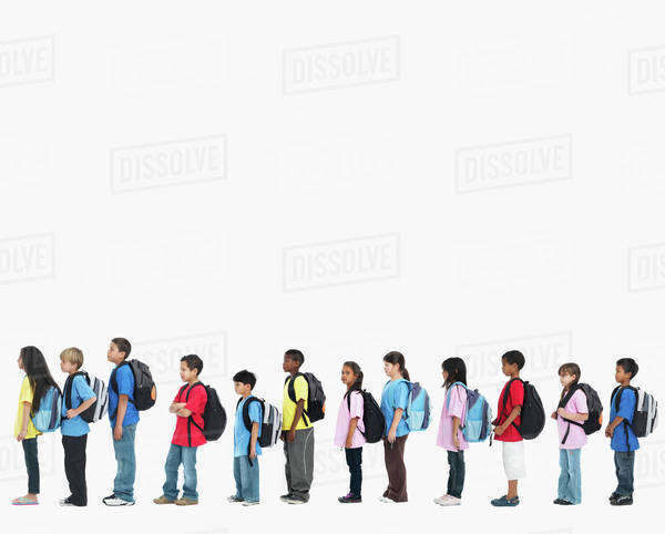 Line of children wearing backpacks - Stock Photo - Dissolve