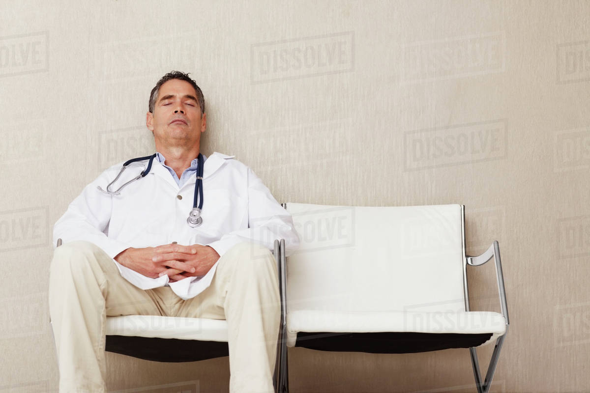 Doctor sitting in waiting room - Stock Photo - Dissolve