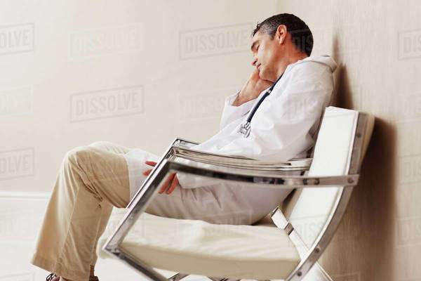 Doctor sitting in waiting room - Stock Photo - Dissolve