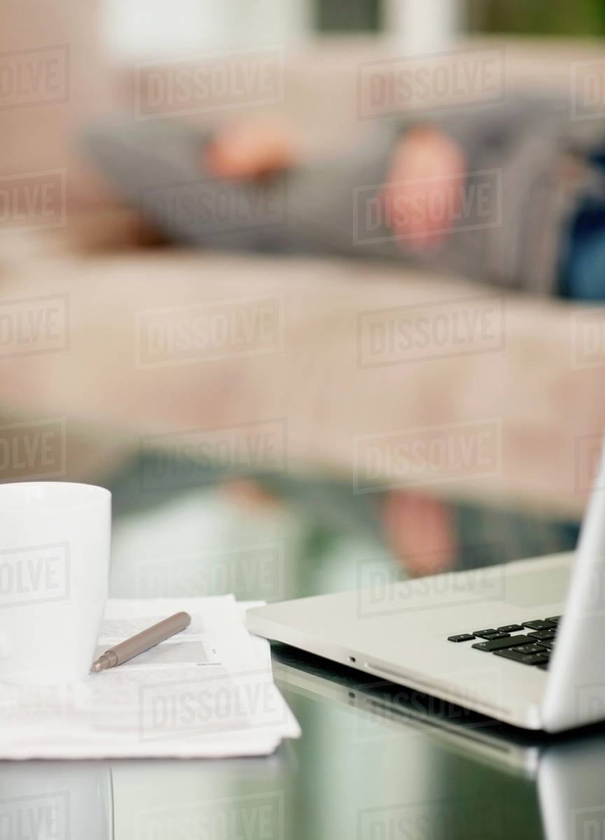 Paperwork and laptop on desk - Royalty-free Stock Photo | Dissolve