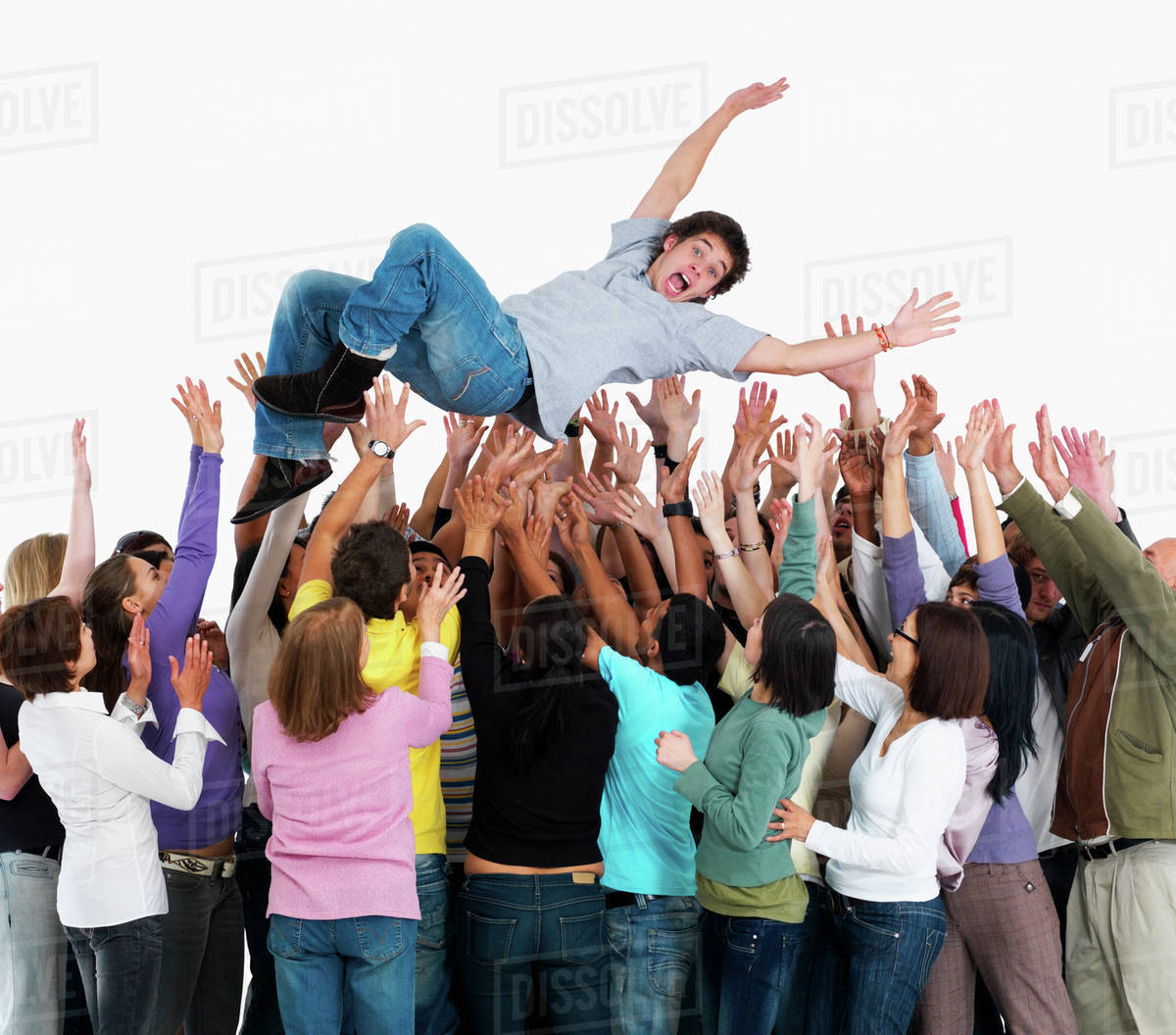 Group of people carrying man - Stock Photo - Dissolve
