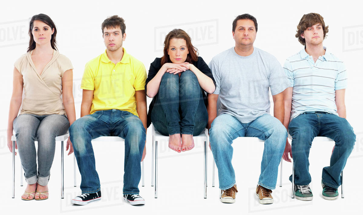 Bored people sitting on chairs - Stock Photo - Dissolve