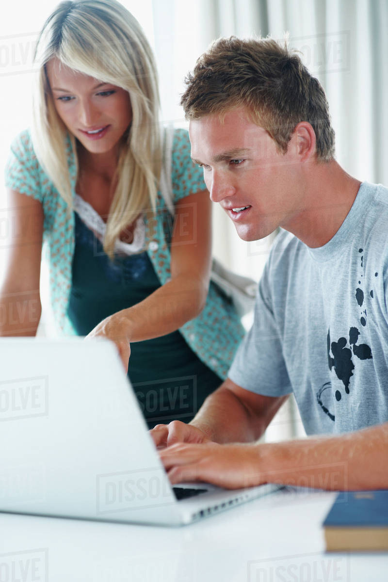 Students working on laptop - Stock Photo - Dissolve