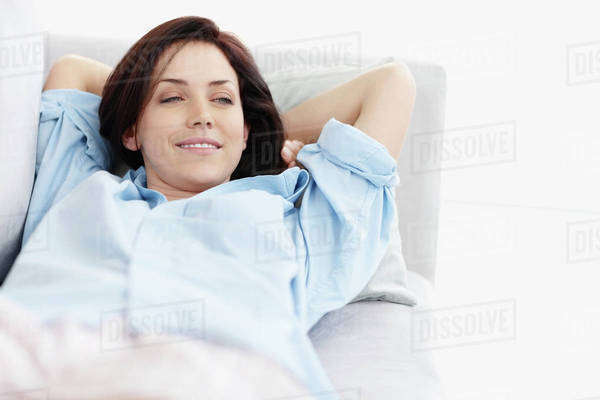 Brunette woman resting - Royalty-free Stock Photo | Dissolve
