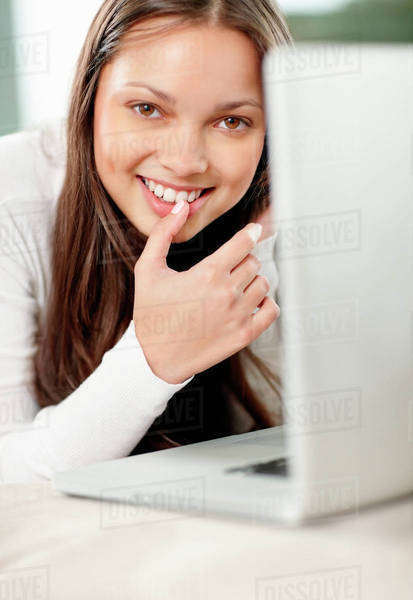 Woman browsing the internet - Stock Photo - Dissolve