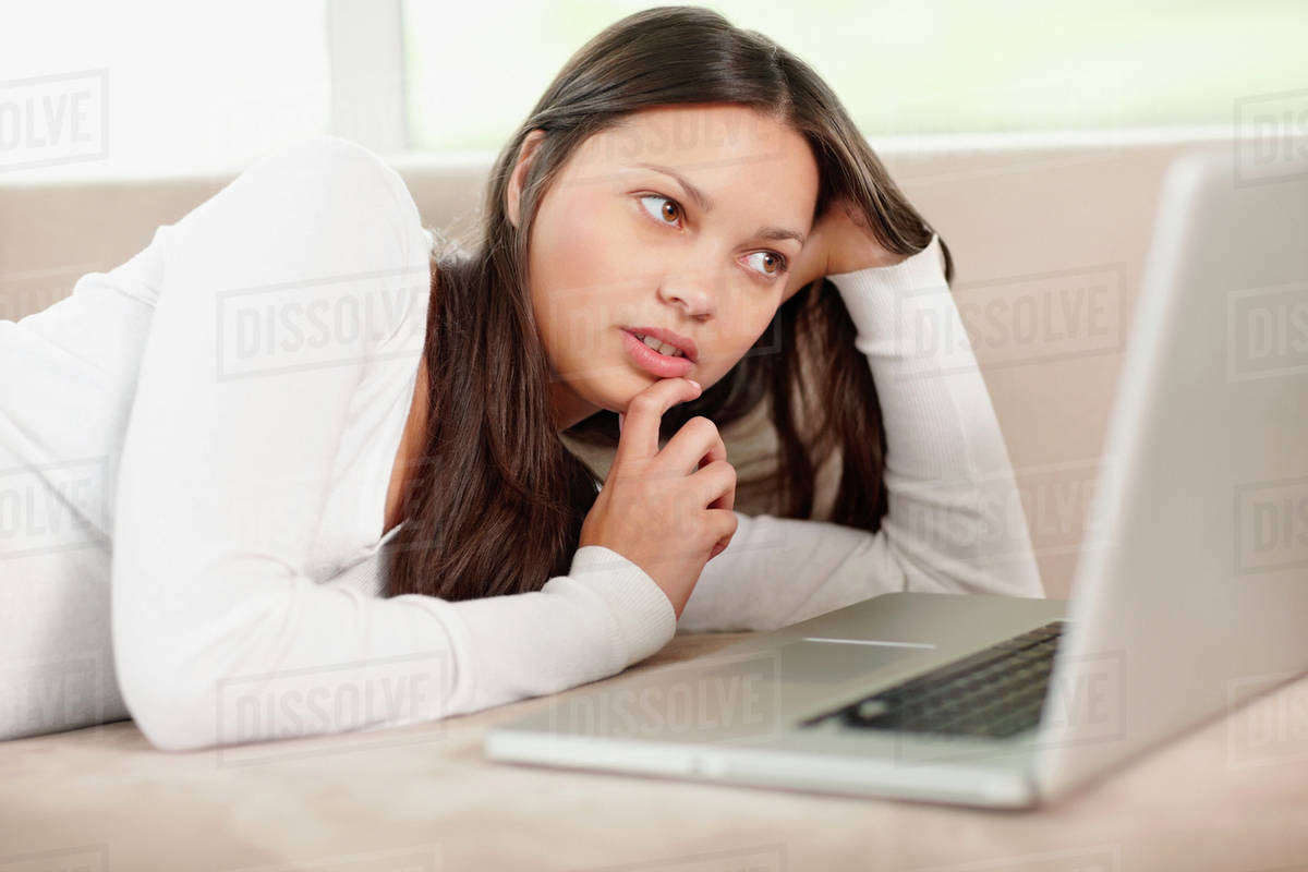 Woman browsing the internet - Royalty-free Stock Photo | Dissolve