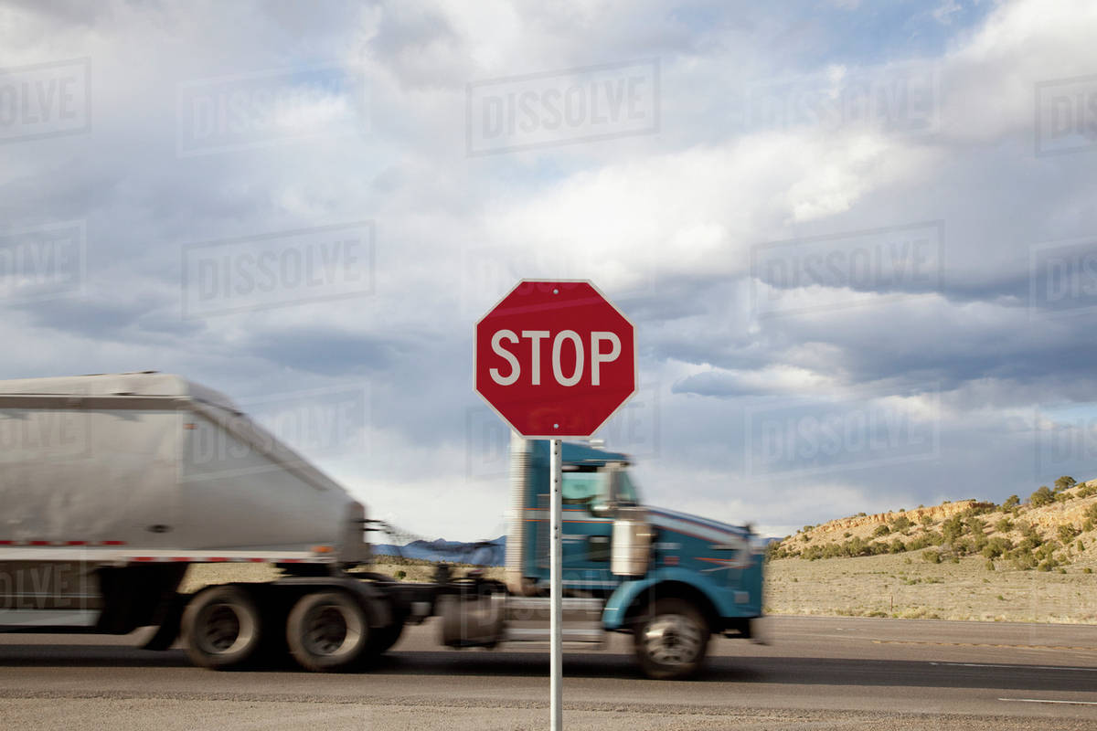 Truck passing stop sign - Royalty-free Stock Photo | Dissolve