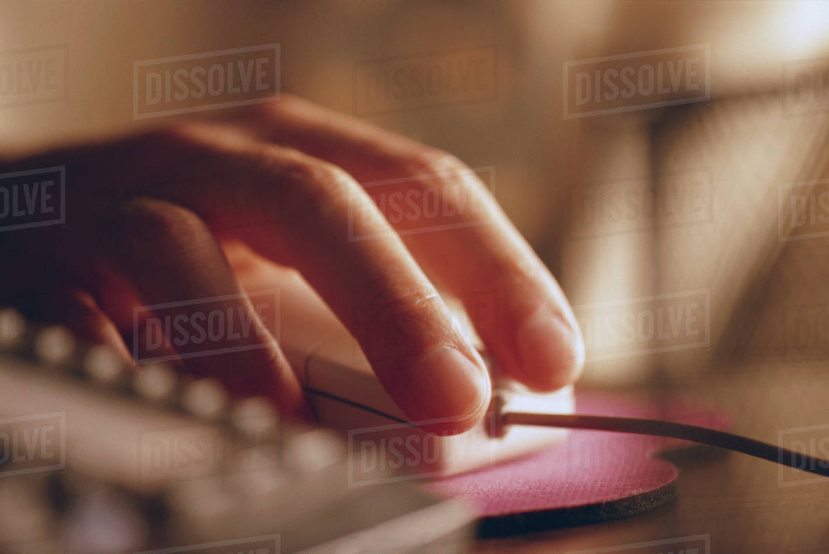 Hand on a computer mouse - Royalty-free Stock Photo | Dissolve