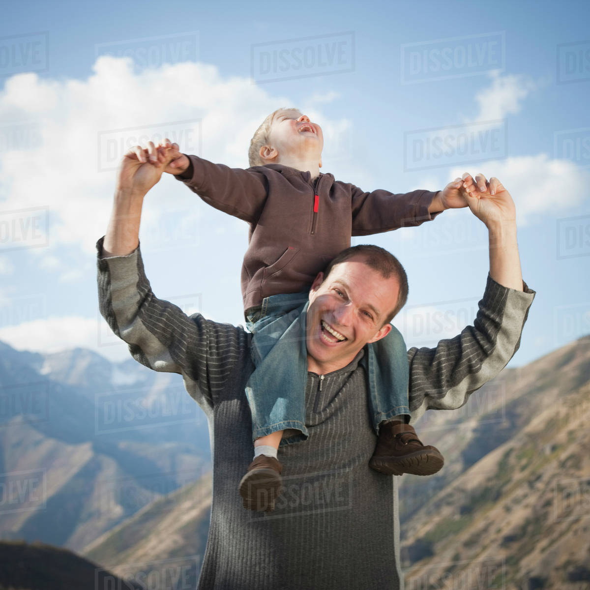 Father and son outdoors - Royalty-free Stock Photo | Dissolve