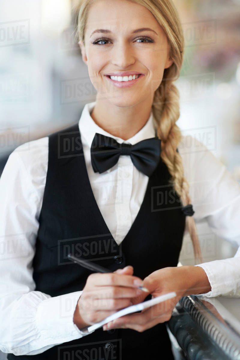 Portrait of smiling waitress - Royalty-free Stock Photo | Dissolve