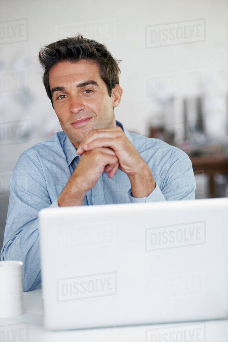 Portrait of man with laptop - Royalty-free Stock Photo | Dissolve