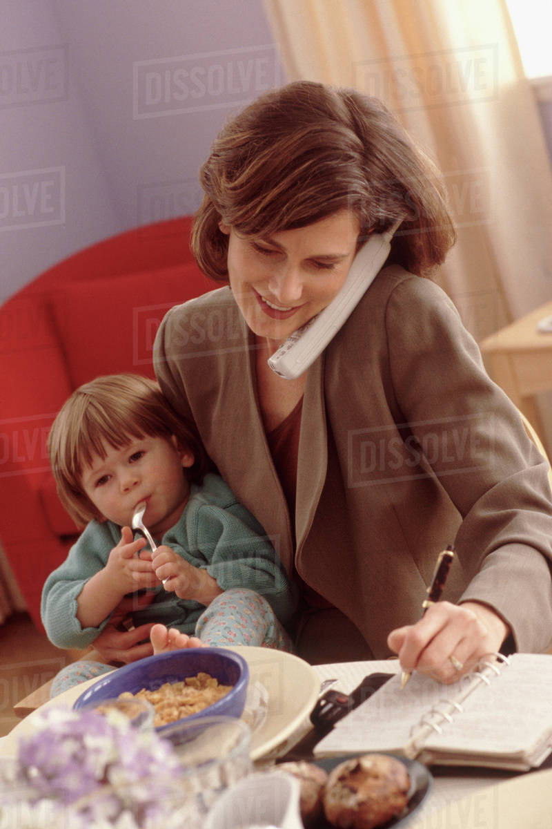 Multi tasking mother - Royalty-free Stock Photo | Dissolve