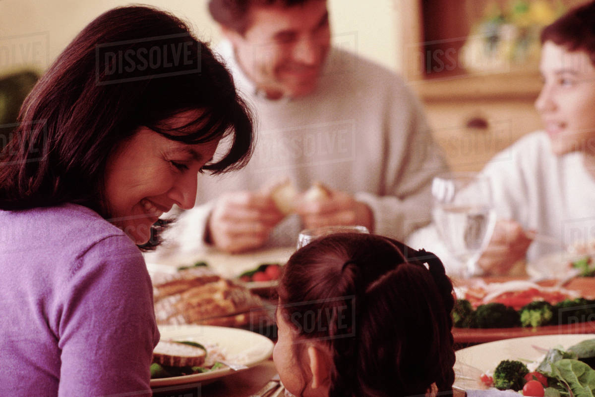 Family eating dinner at home - Royalty-free Stock Photo | Dissolve