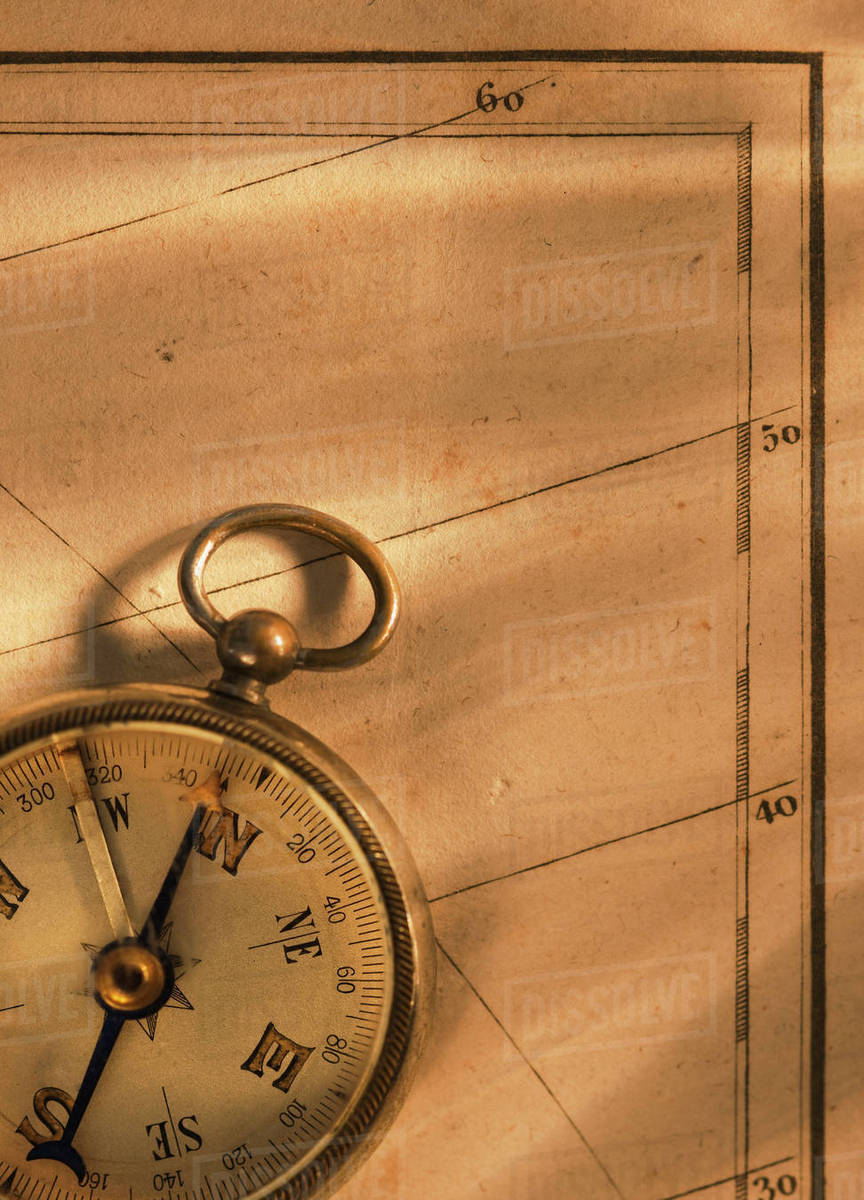 Close up of antique map and compass - Stock Photo - Dissolve