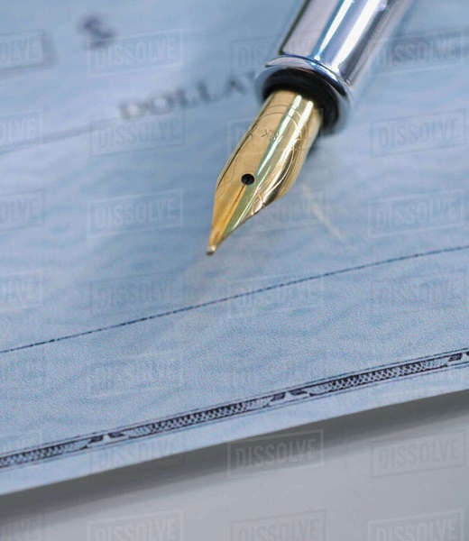 Pen and personal check - Royalty-free Stock Photo | Dissolve