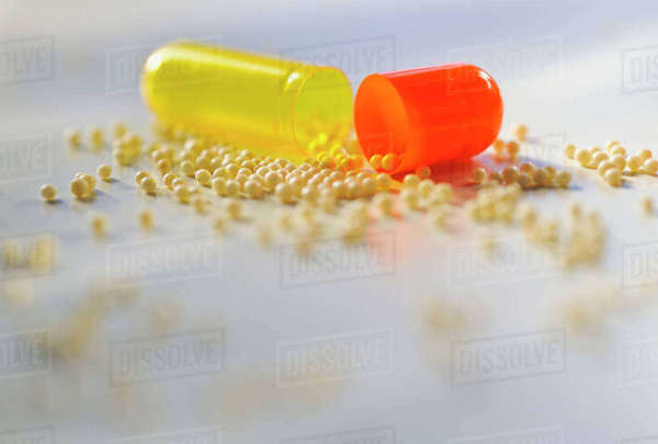 Broken medicine capsule - Royalty-free Stock Photo | Dissolve