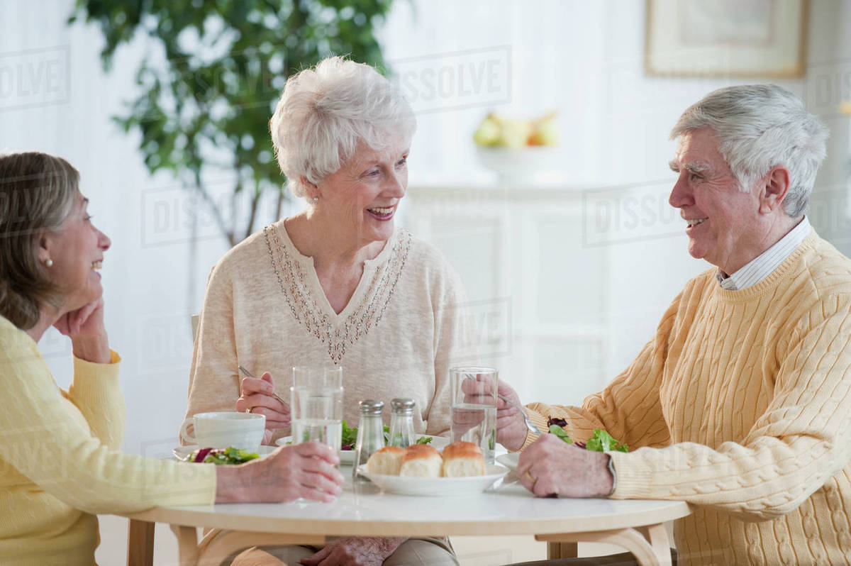 Senior adults eating dinner - Royalty-free Stock Photo | Dissolve