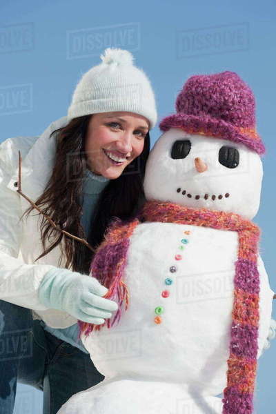 Woman and snowman, portrait - Royalty-free Stock Photo | Dissolve