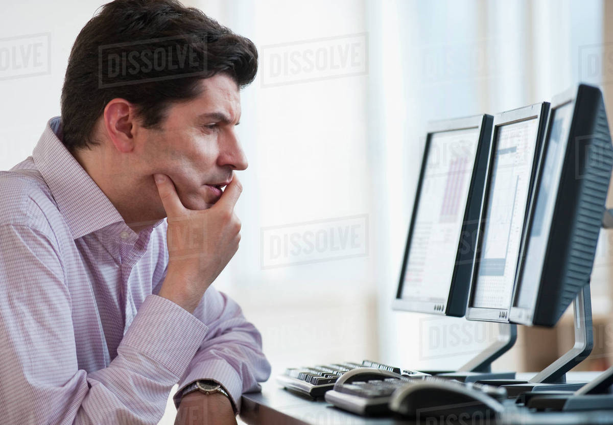 A businessman using a computer - Stock Photo - Dissolve