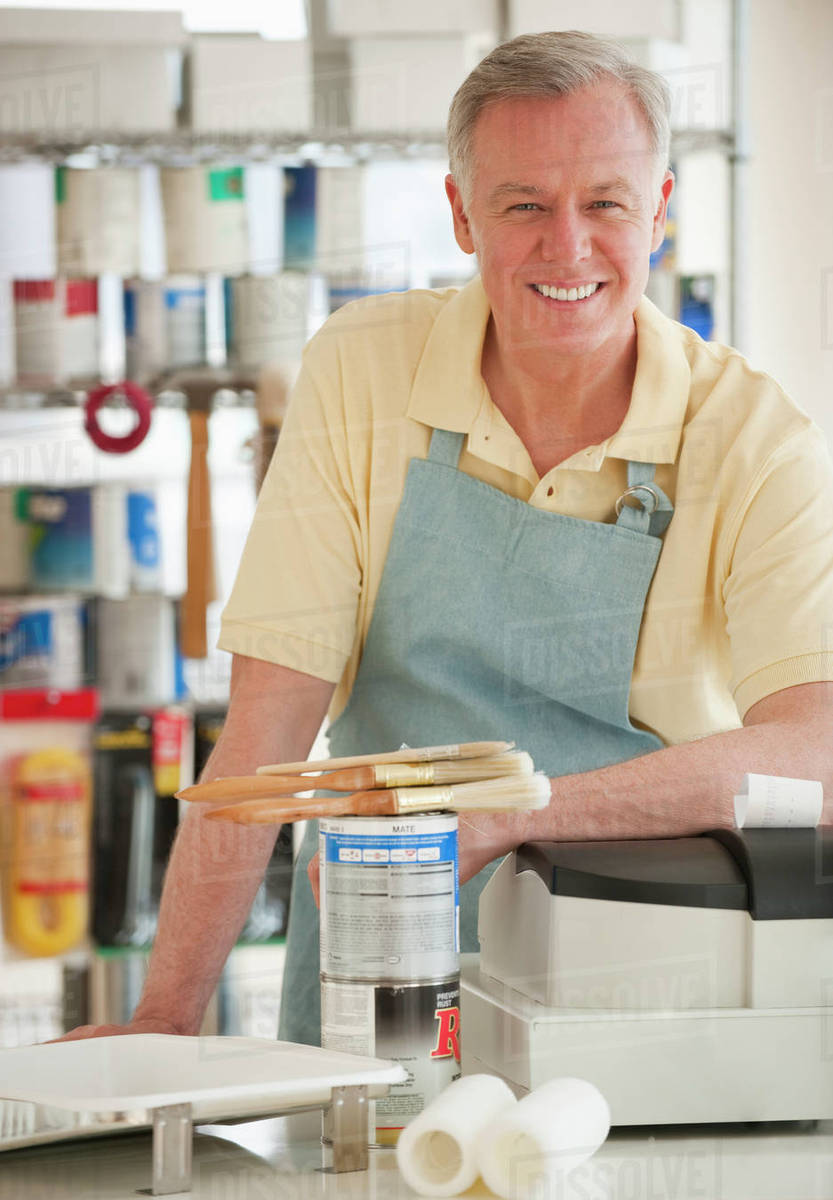 A man working at a paint store - Royalty-free Stock Photo | Dissolve