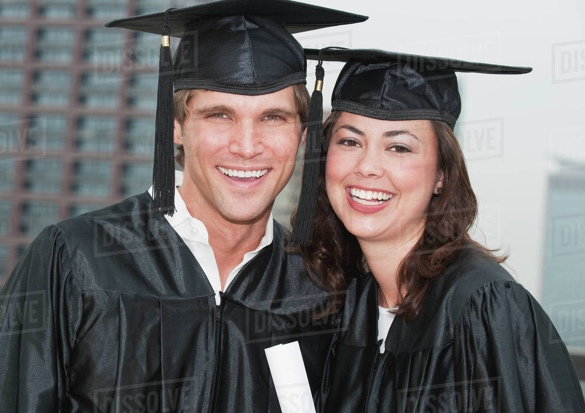 A young woman and young man graduating - Royalty-free Stock Photo ...