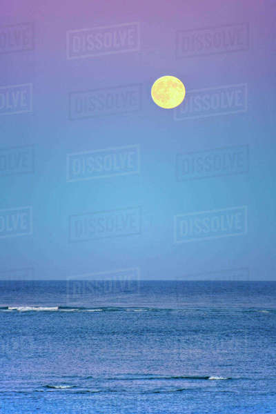 Moonrise over ocean - Stock Photo - Dissolve