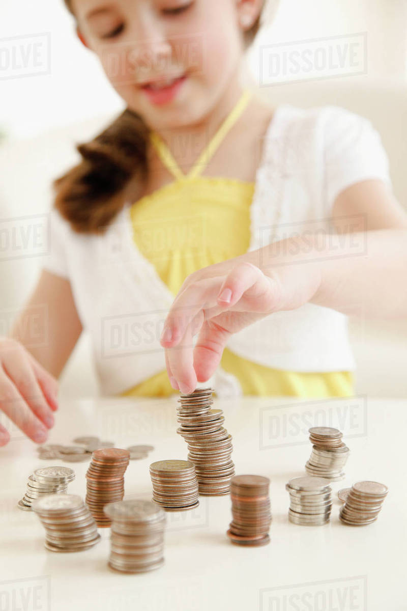 Child paying with money - Royalty-free Stock Photo | Dissolve