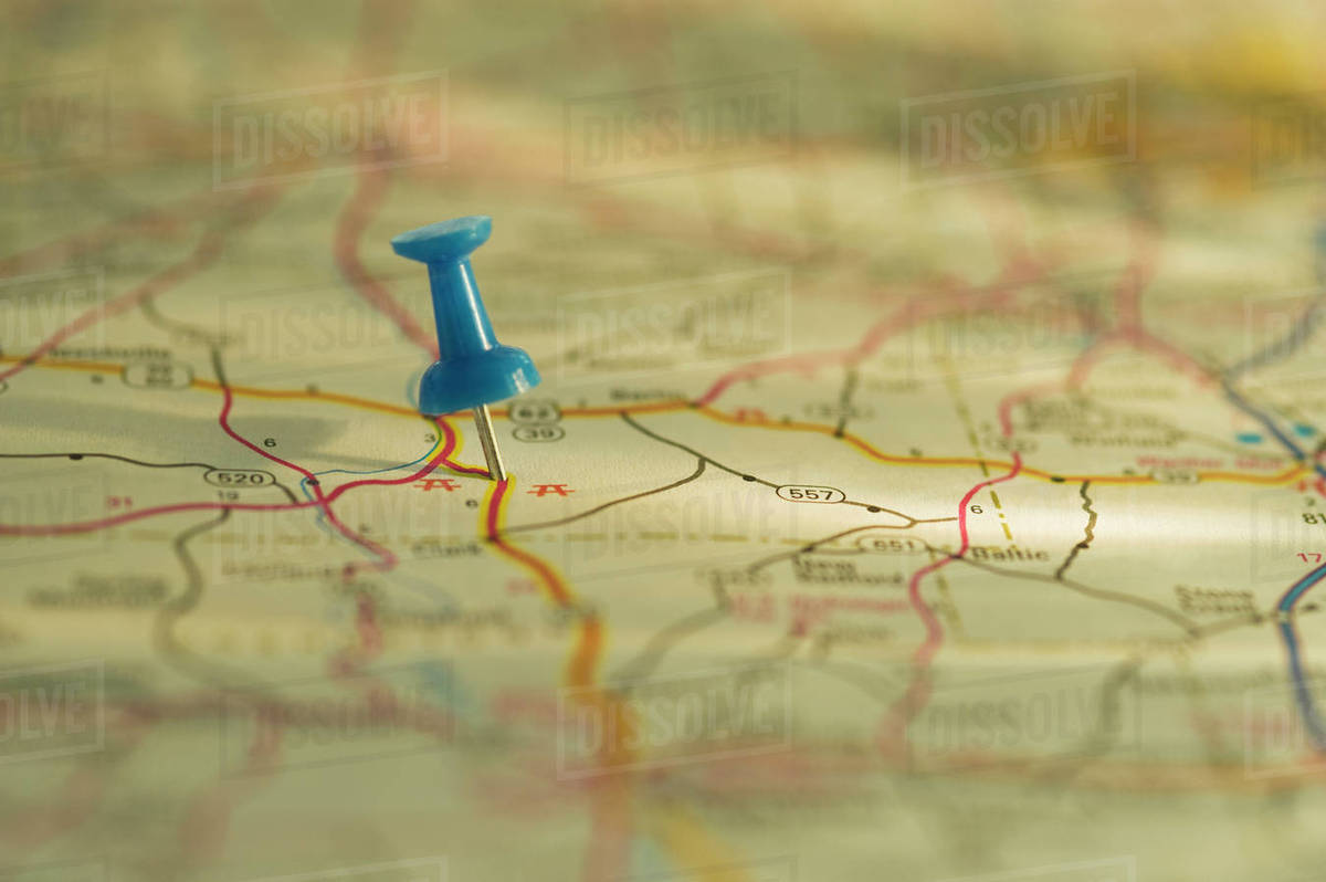 Close up of pin on map location - Stock Photo - Dissolve