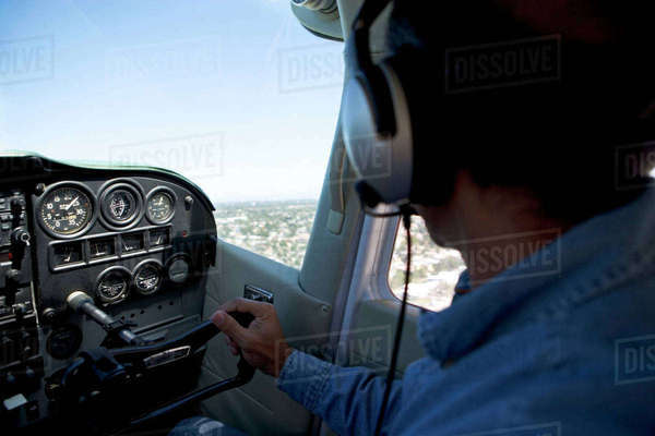 Pilot in cockpit - Stock Photo - Dissolve