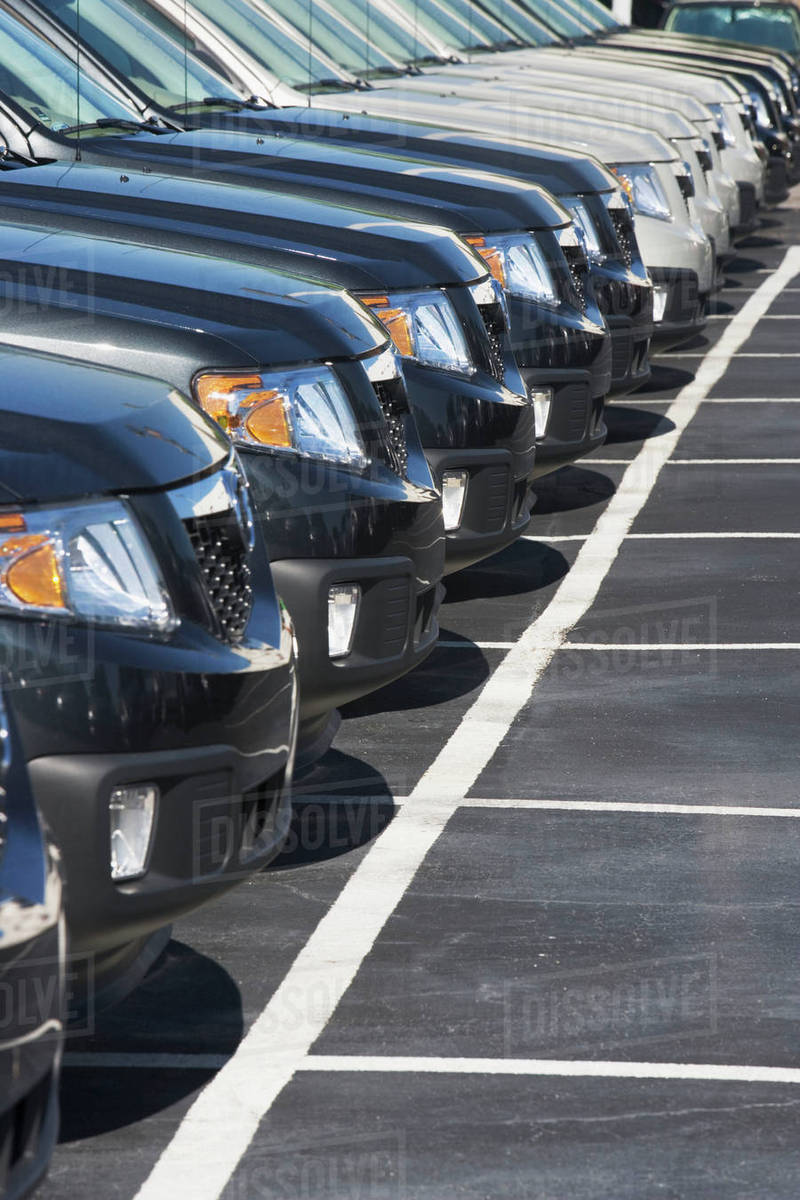 Row of cars in car lot - Royalty-free Stock Photo | Dissolve