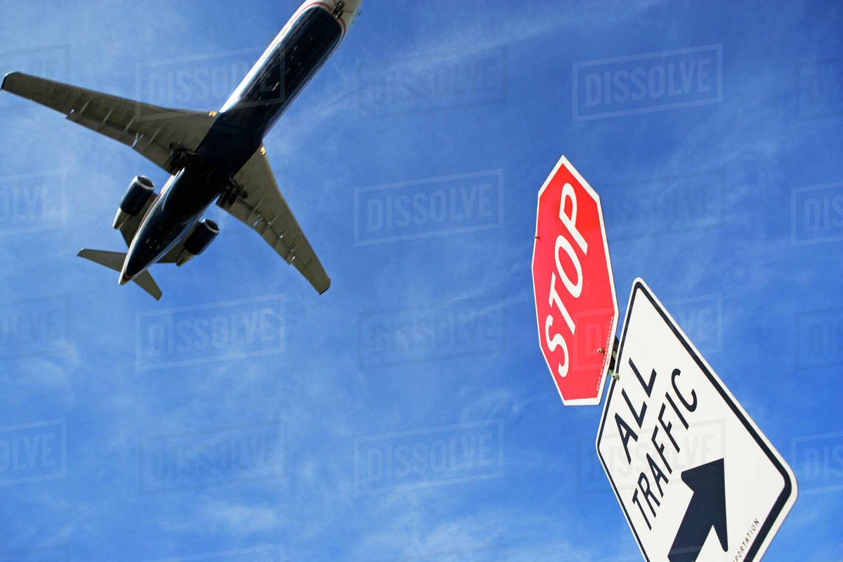 Airplane and traffic sign - Royalty-free Stock Photo | Dissolve