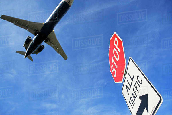 Airplane and traffic sign - Royalty-free Stock Photo | Dissolve