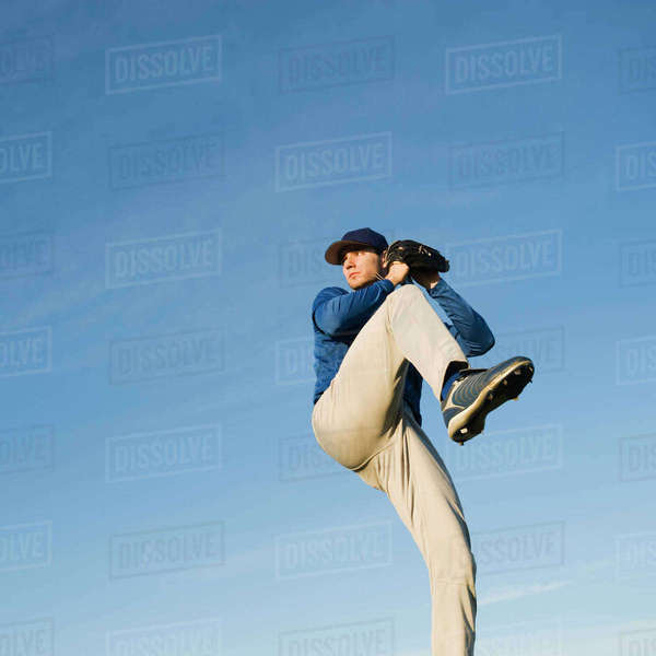 Baseball player throwing ball - Royalty-free Stock Photo | Dissolve
