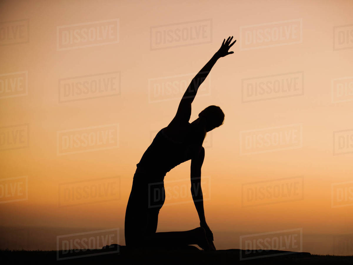Silhouette of person stretching - Royalty-free Stock Photo | Dissolve