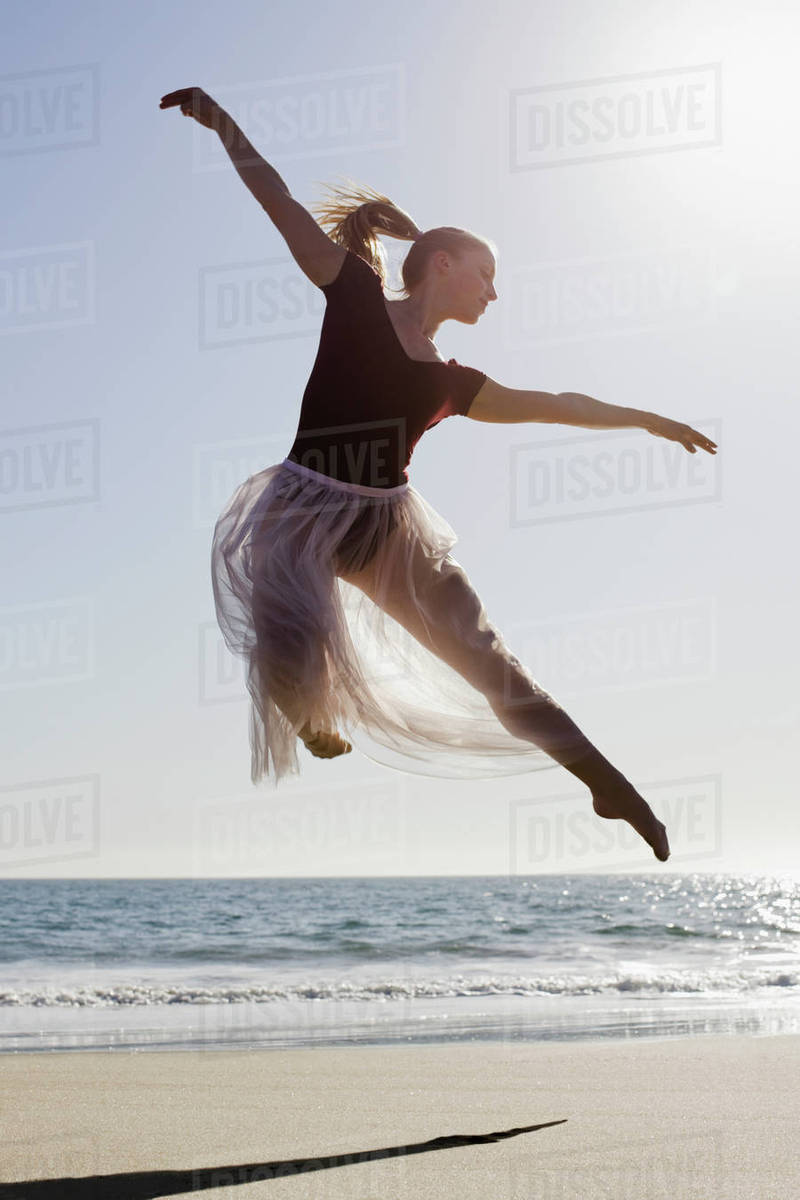 Dancer Leaping On Beach