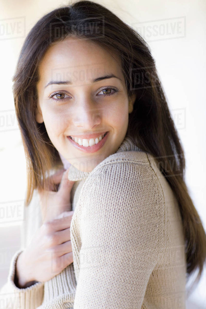 A woman smiling and huggin arms to chest - Royalty-free Stock Photo ...