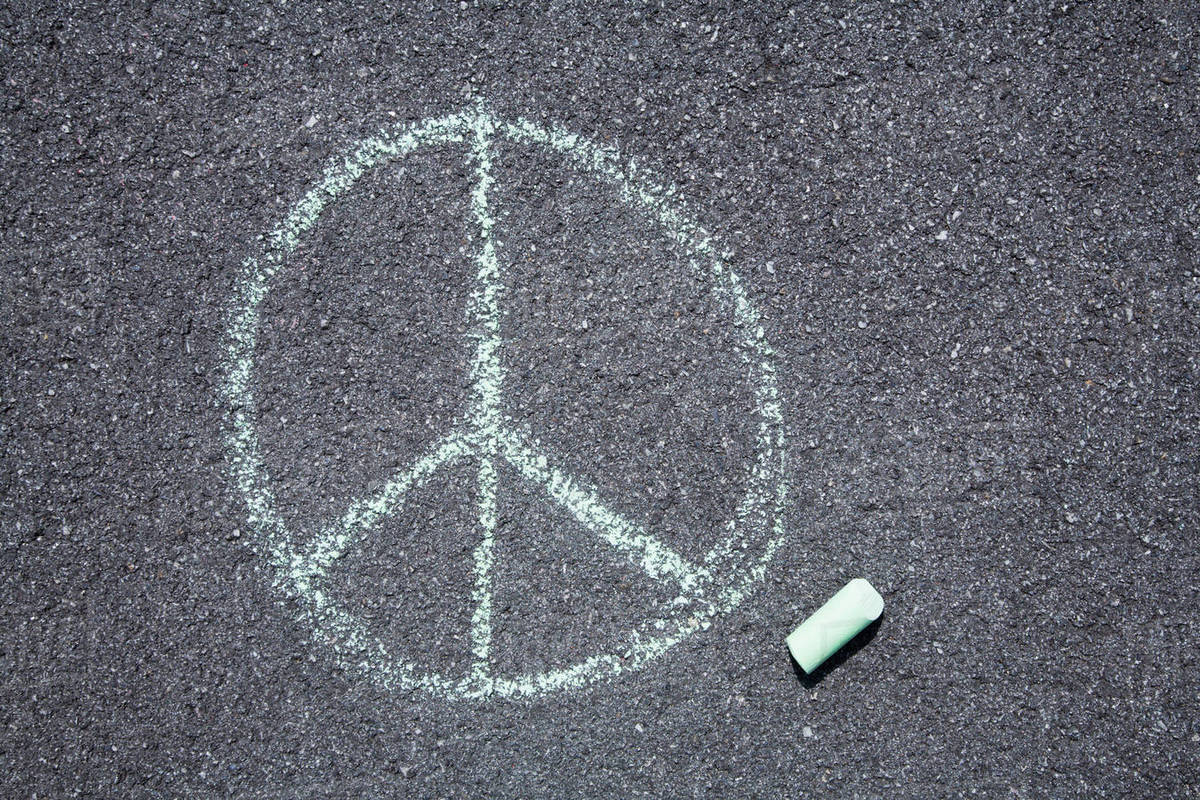 Peace sign on pavement - Stock Photo - Dissolve