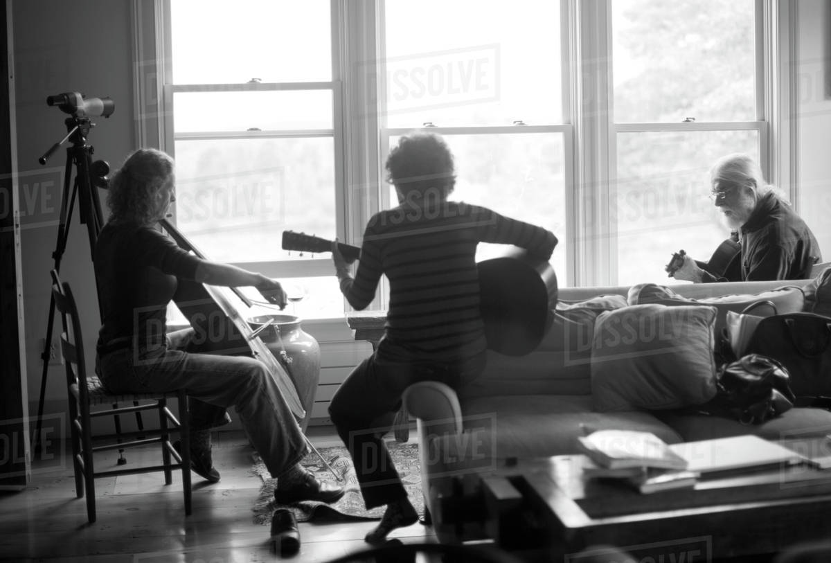Three people playing together - Stock Photo - Dissolve