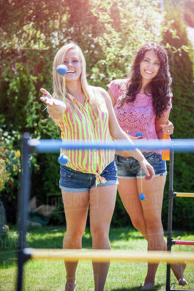 Portrait of young women throwing balls - Royalty-free Stock Photo ...