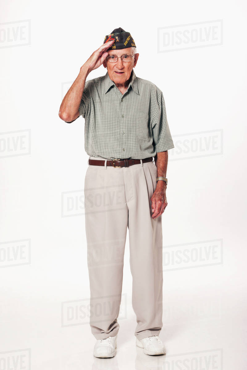 Portrait of senior man standing and saluting at camera - Royalty-free ...
