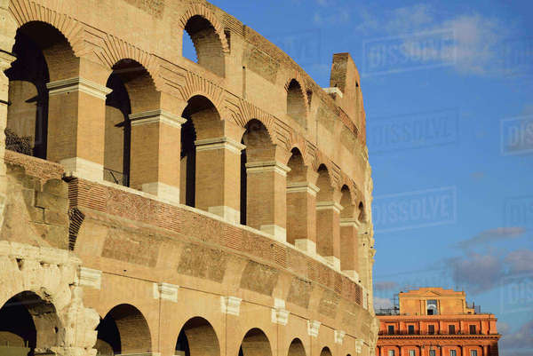 Facade of Coliseum against cloudy sky - Stock Photo - Dissolve