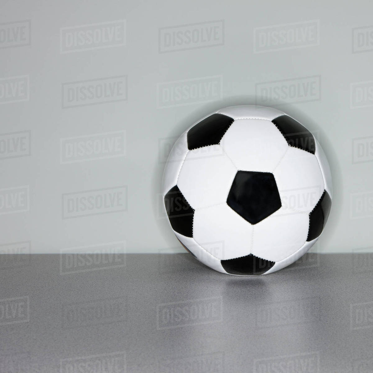 Soccer ball next to wall - Royalty-free Stock Photo | Dissolve