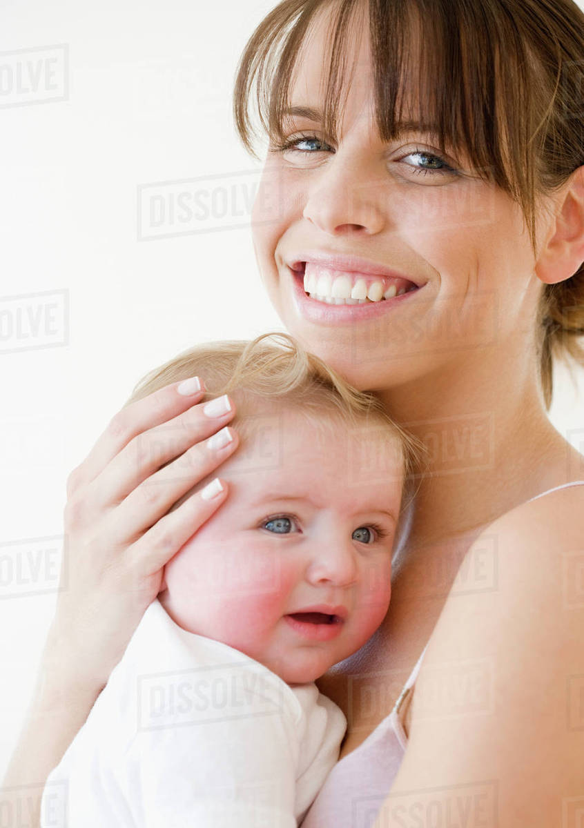 Mother hugging baby - Royalty-free Stock Photo | Dissolve