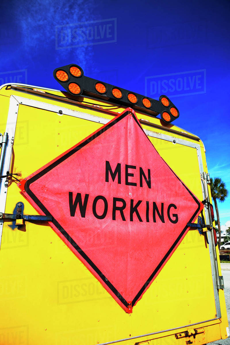 Men working sign - Stock Photo - Dissolve