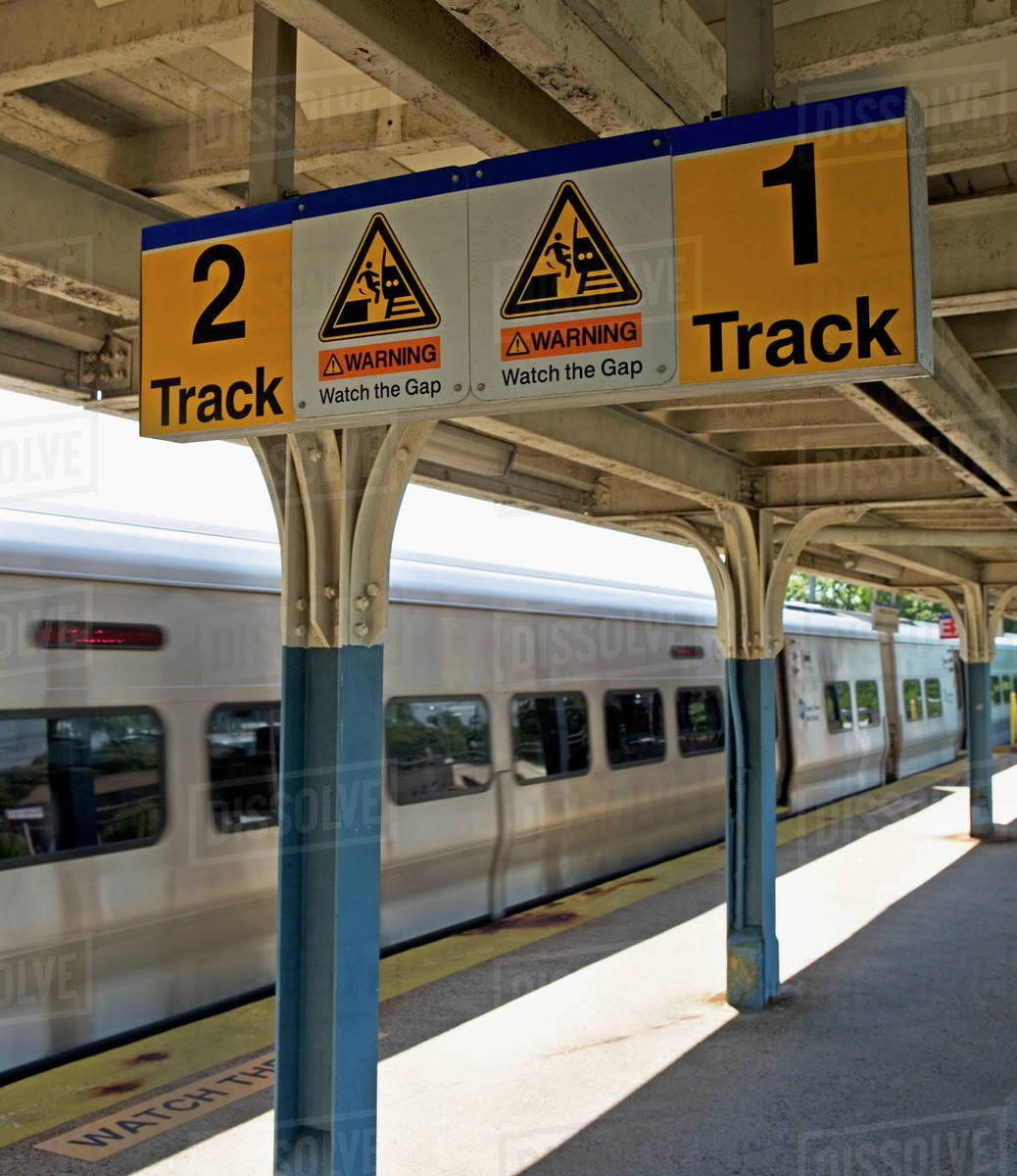 Commuter train arriving at station platform - Royalty-free Stock Photo ...