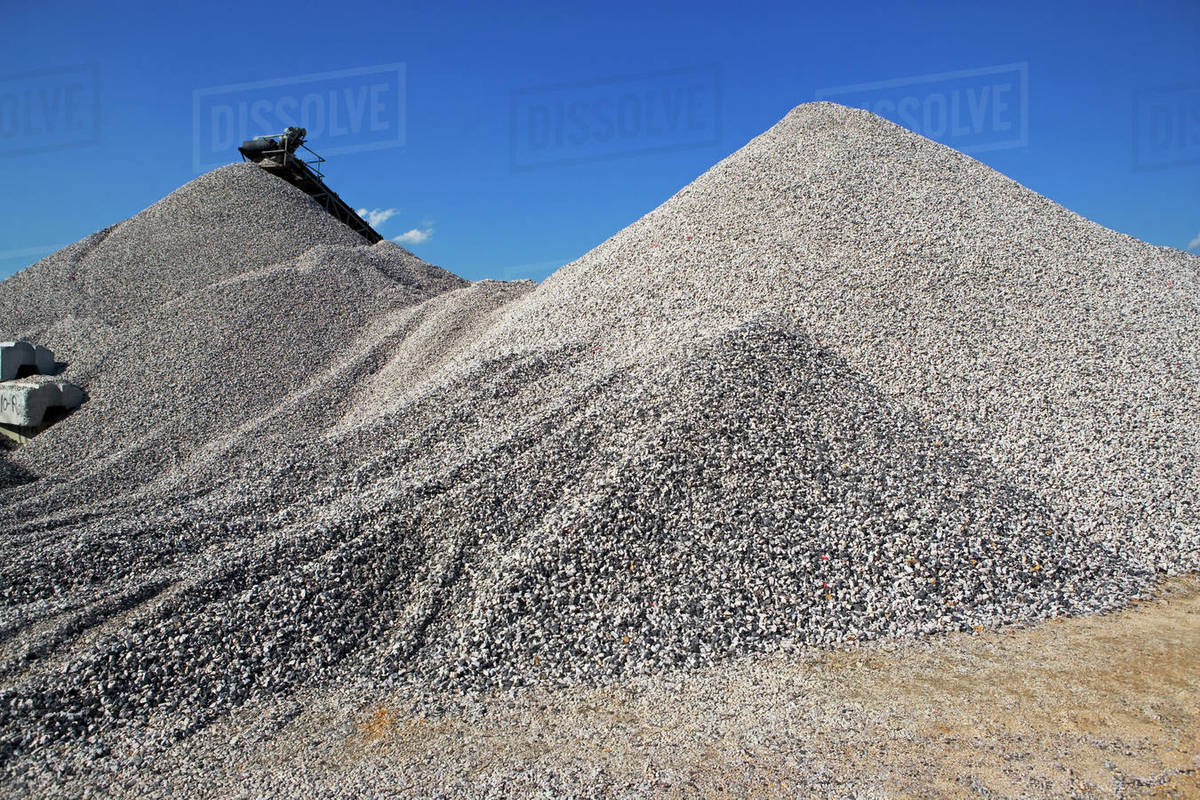 Gravel mounds at concrete plant - Royalty-free Stock Photo | Dissolve